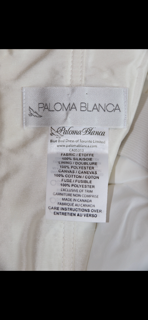 Paloma Blanca Strapless silk gown with some liquid stains at the botto ...